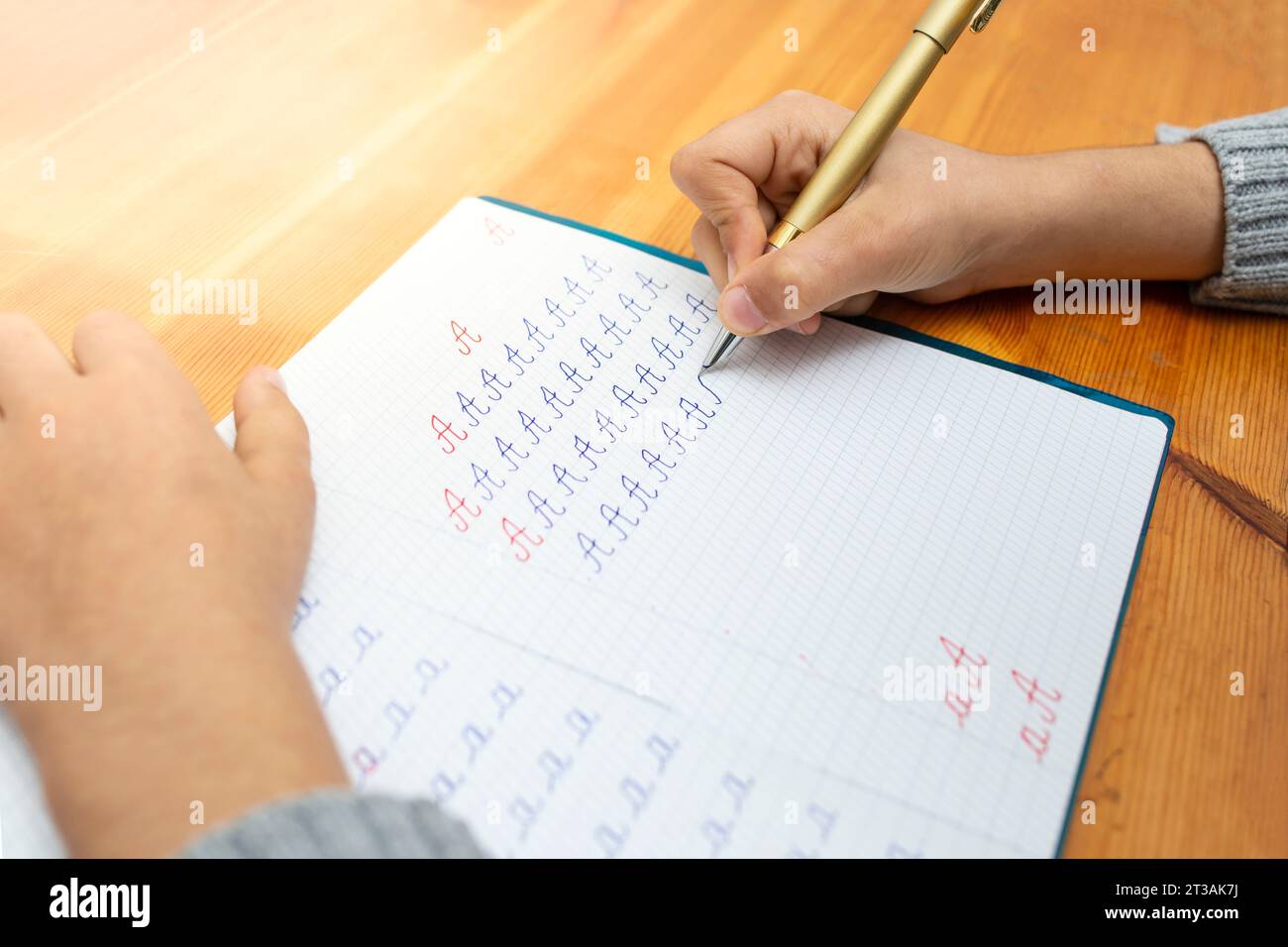 Child hands doing homework, writing capita A letter, soft focus Stock ...