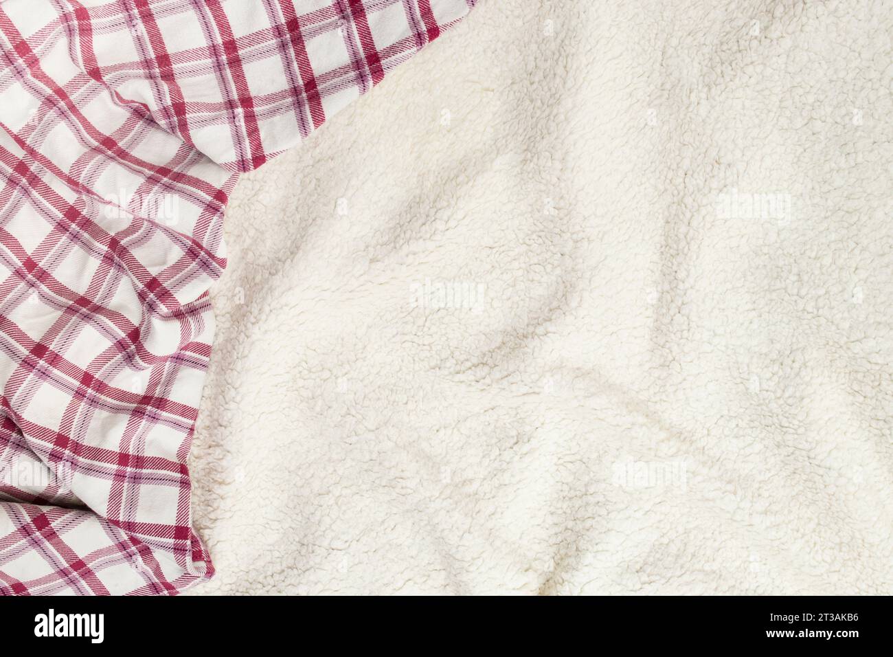 Vintage pajamas pattern fabric on a fluffy blanket background, empty ...