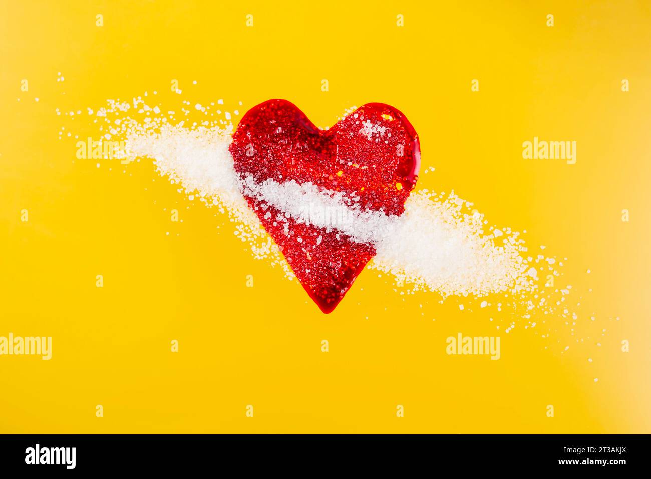 Red blood splatter in form of a heart mixed with sugar crystals on ...