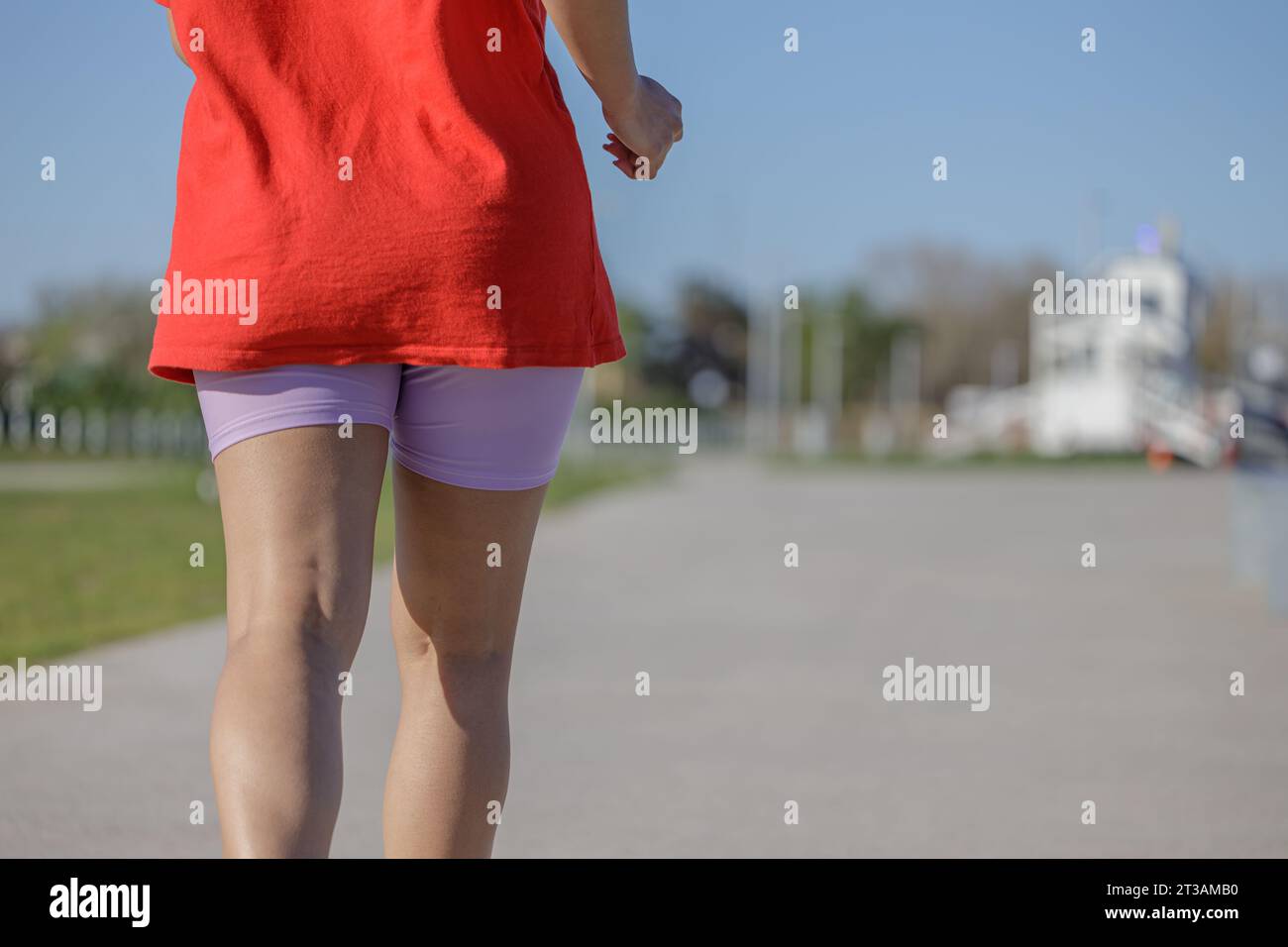 Woman running through the city hi-res stock photography and images - Alamy