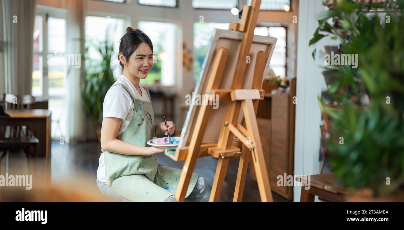 Talented Female Artist Working on a artist lifestyle. painting hobby ...