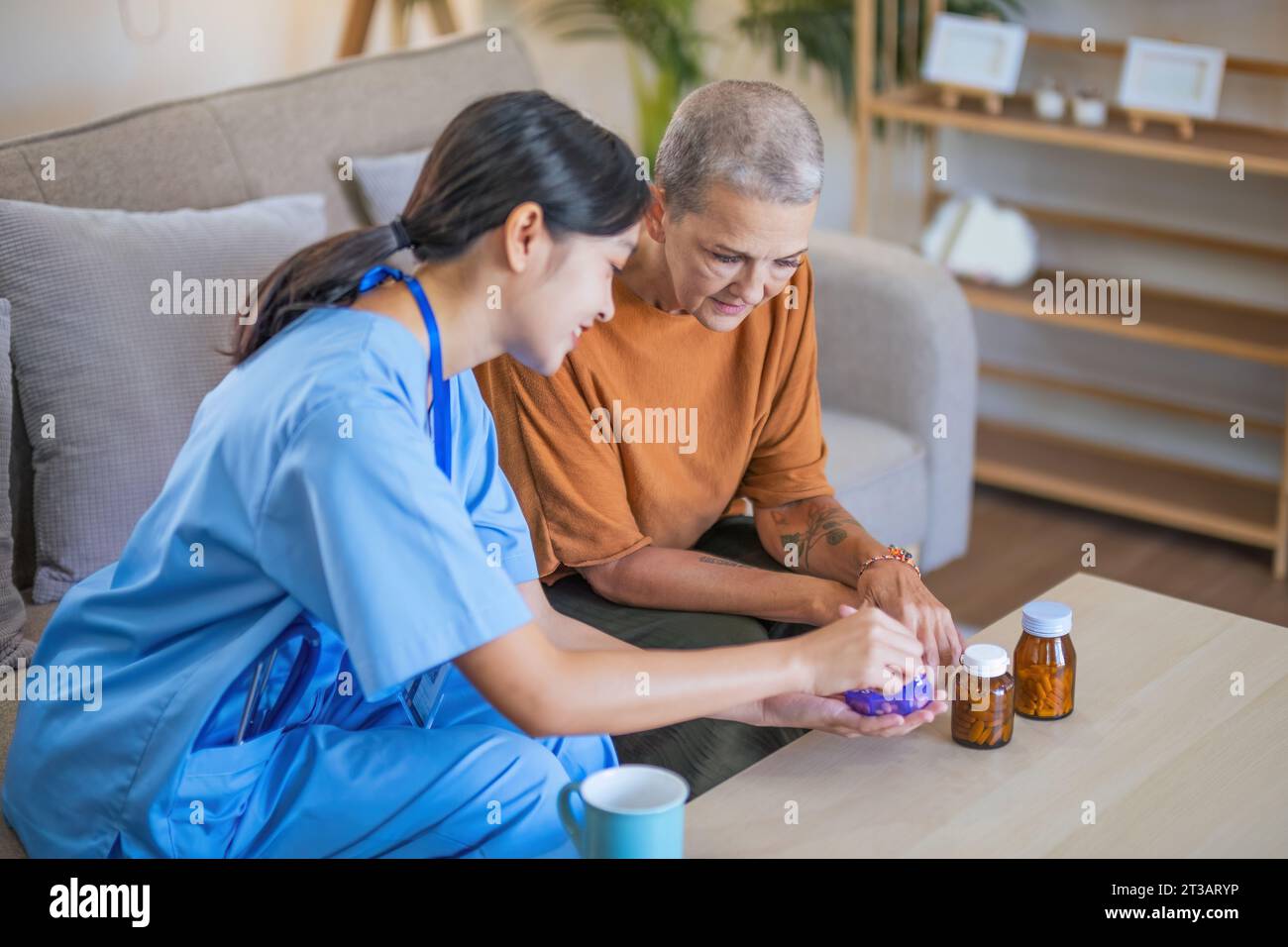 Nurse talks with senior patient about medication. and gives a ...