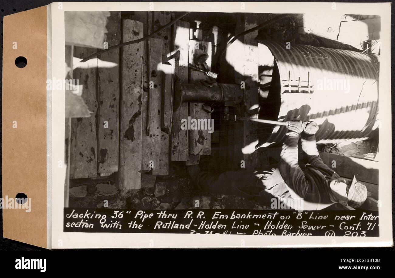 Contract No. 71, WPA Sewer Construction, Holden, jacking 36 in. pipe through railroad embankment ...