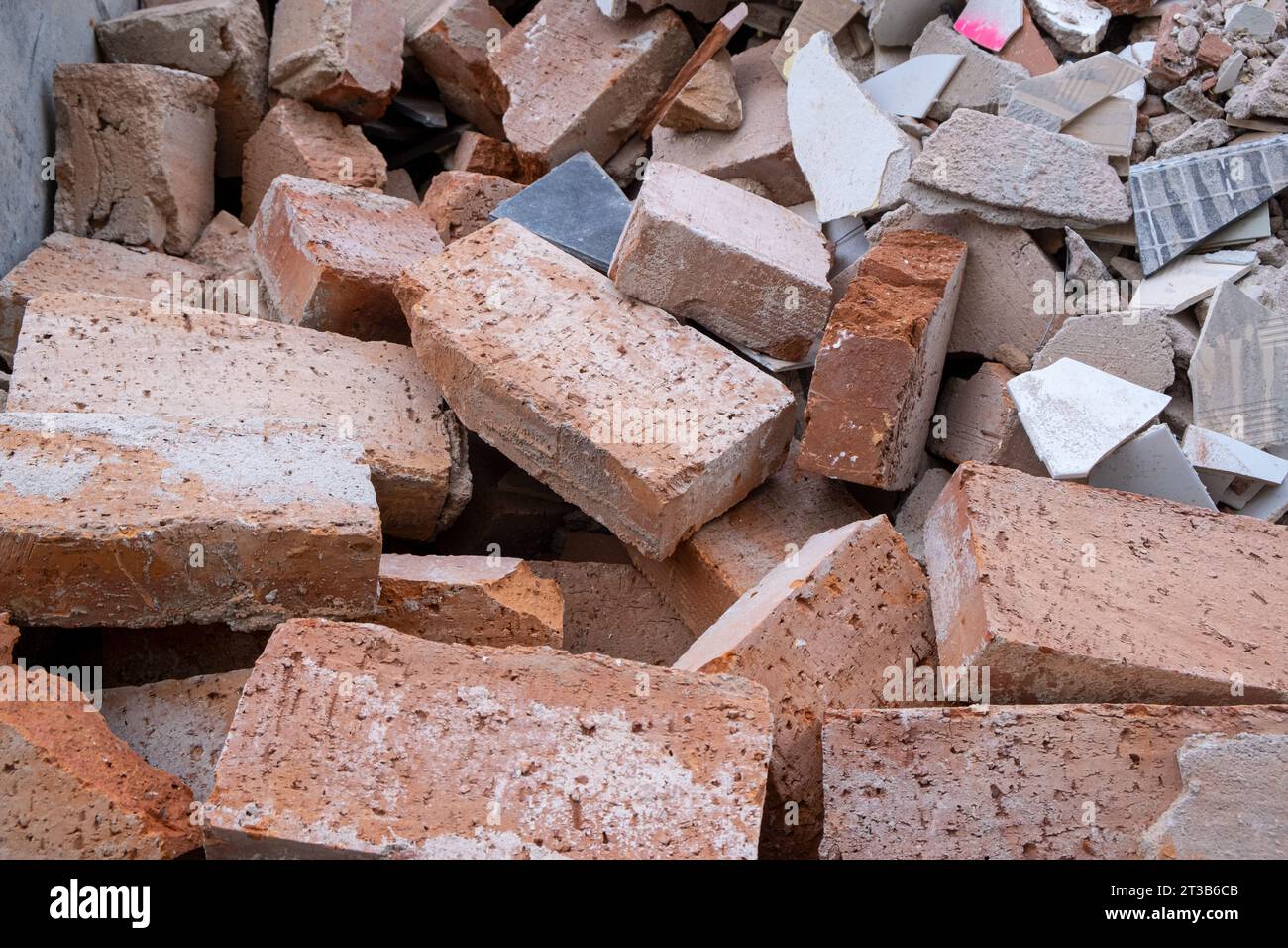 Shattered, broken red clay ceramic bricks, remnants of construction ...