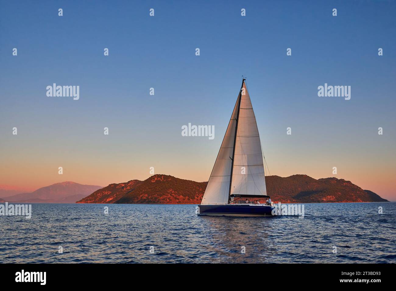 Sailing yacht in the Gulf of Fethiye, southern Turkey sailing at sunset ...