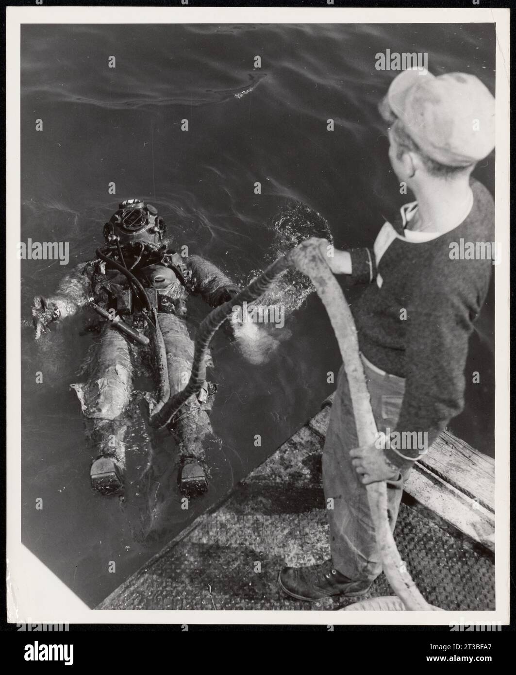 Explorer of the Deep Army Diver M/SGT. Melvin Alderman is raised to the ...