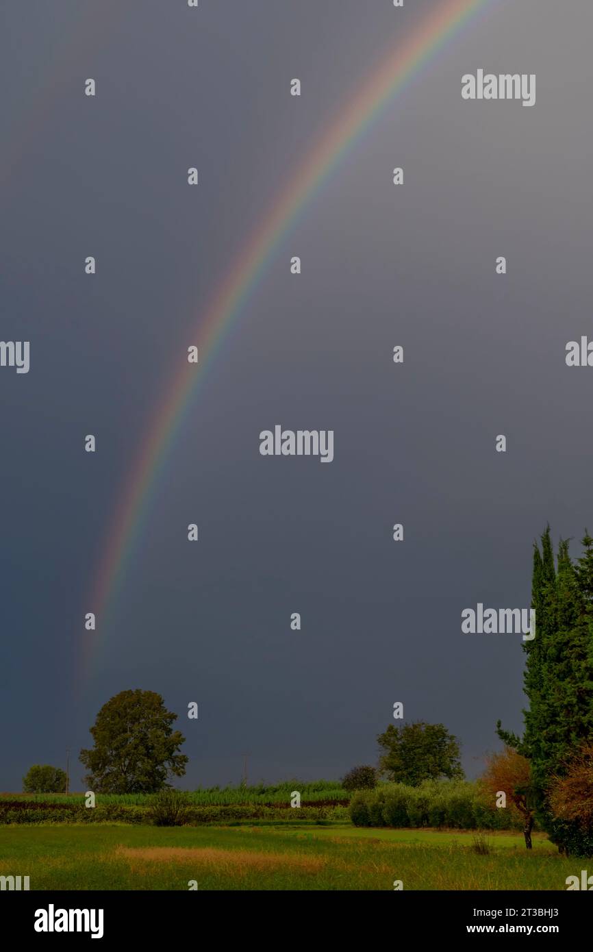 A rainbow over the Tuscan countryside in Fauglia, Pisa, Italy Stock ...