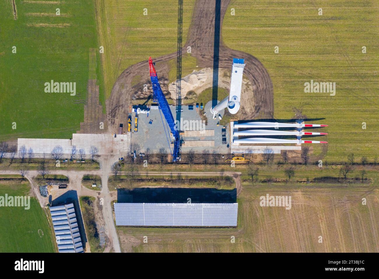 Aerial view over construction site showing rotor blades on the ground ...