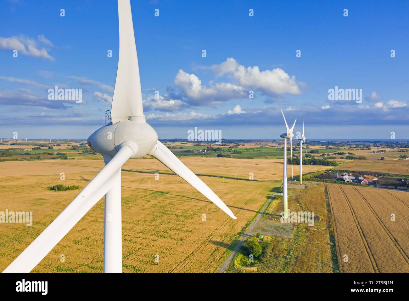 Aerial view over wind turbines at wind park / windfarm in North Frisia ...