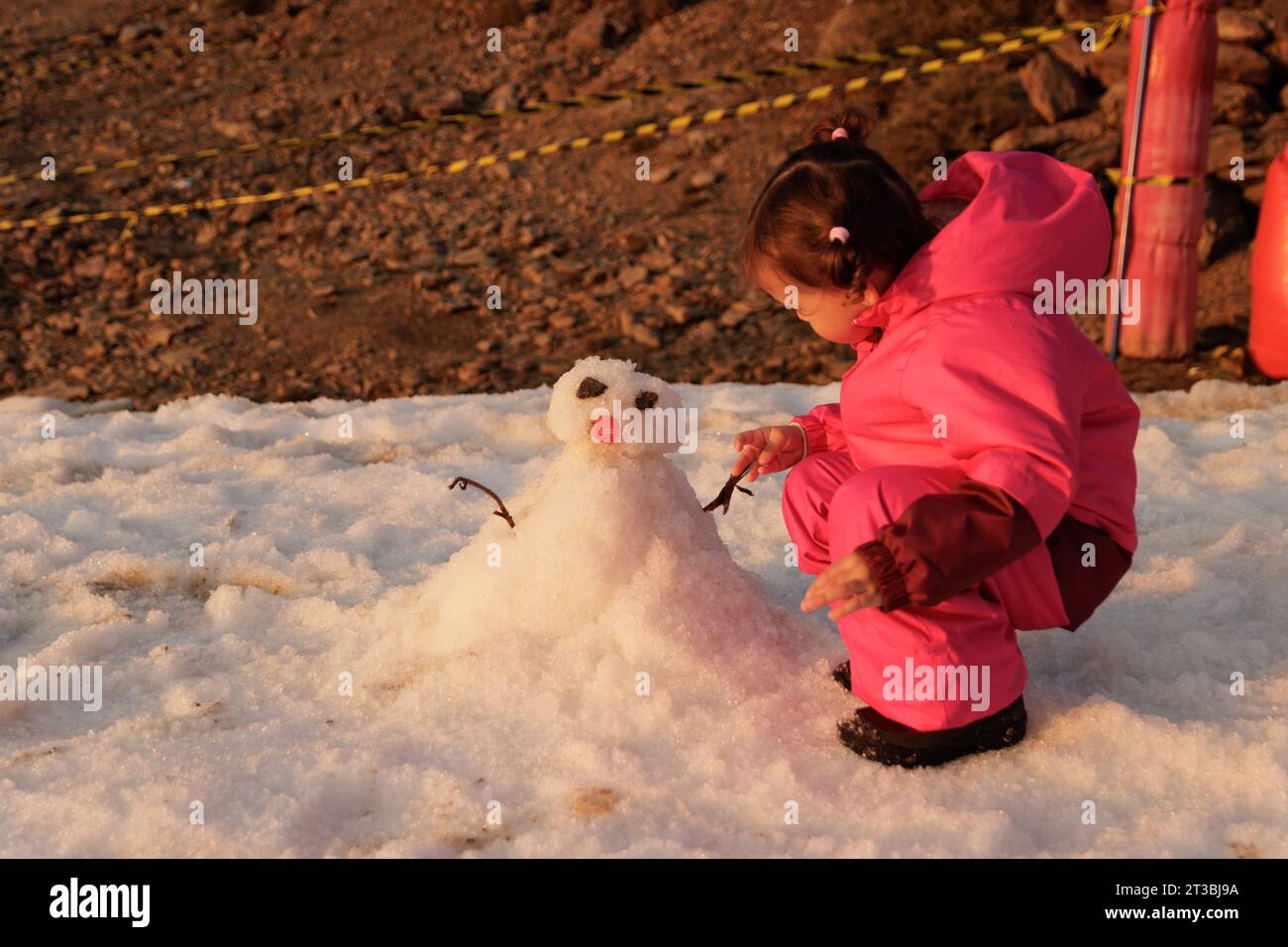Pink snowsuit hi-res stock photography and images - Alamy