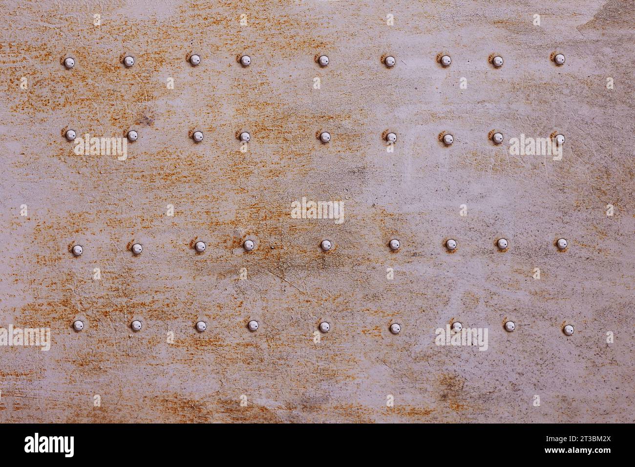 Riveted metal surface, painted red Stock Photo - Alamy