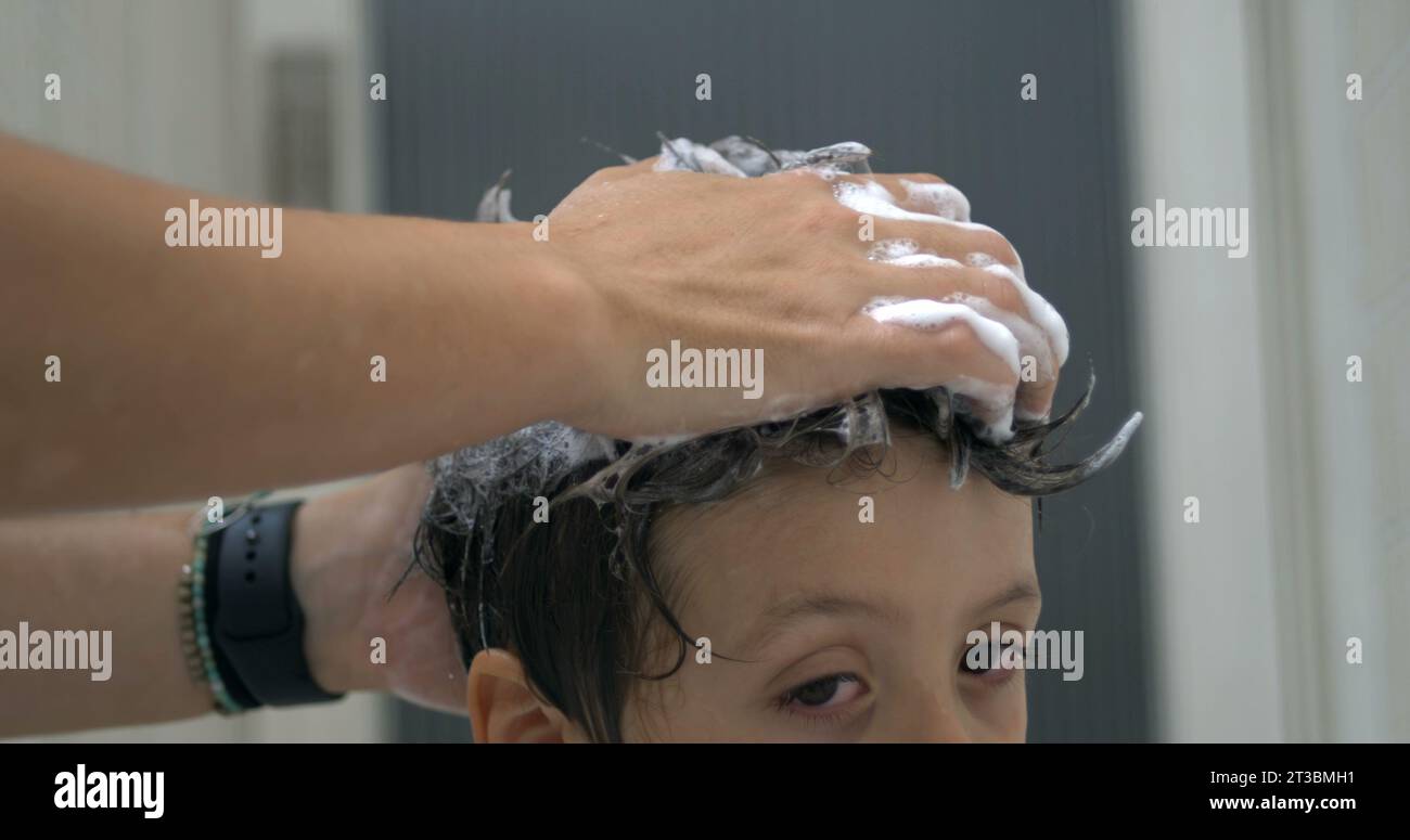 Rubbing in shampoo hi-res stock photography and images - Alamy