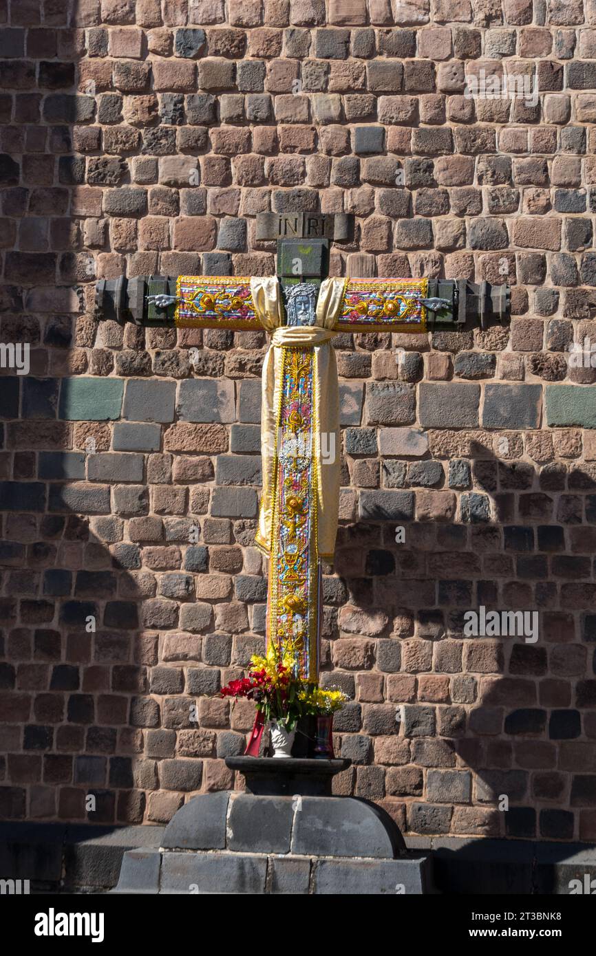 Large cross on the exterior wall of the Santo Domingo Basilica in Cusco ...