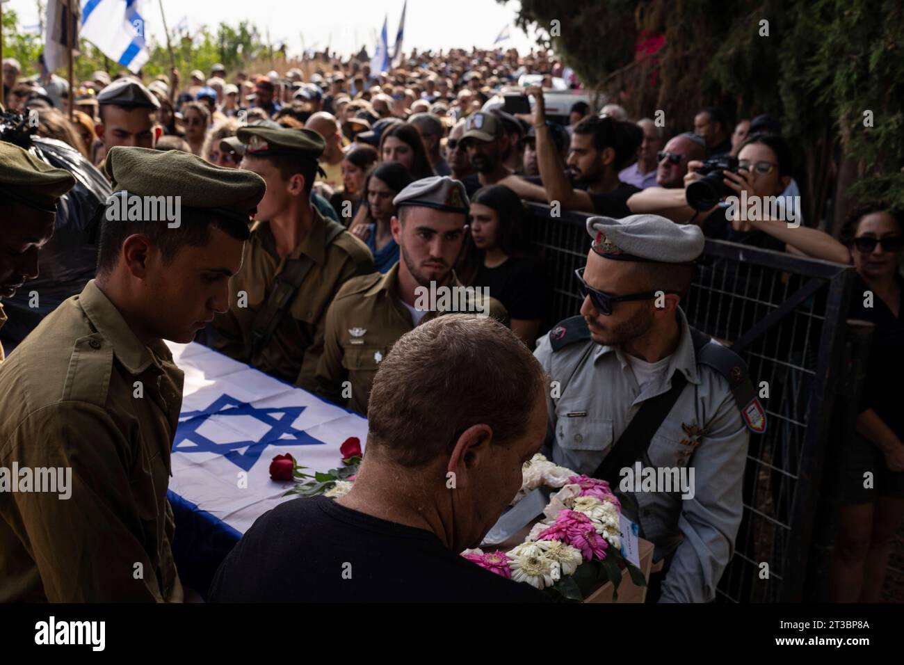 Israeli soldiers carry a coffin draped with the Israeli flag during the ...