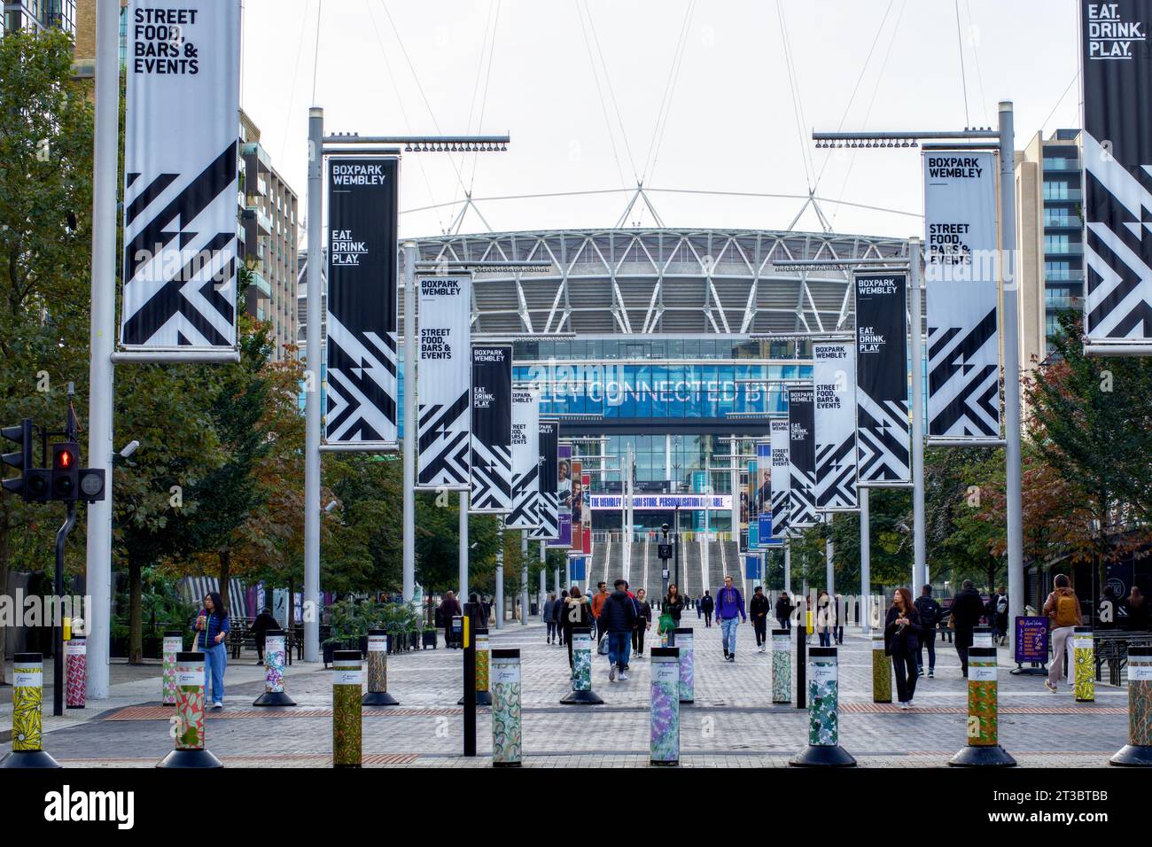 People walking down Olympic Way, Wembley Park, Borough of Brent, London ...