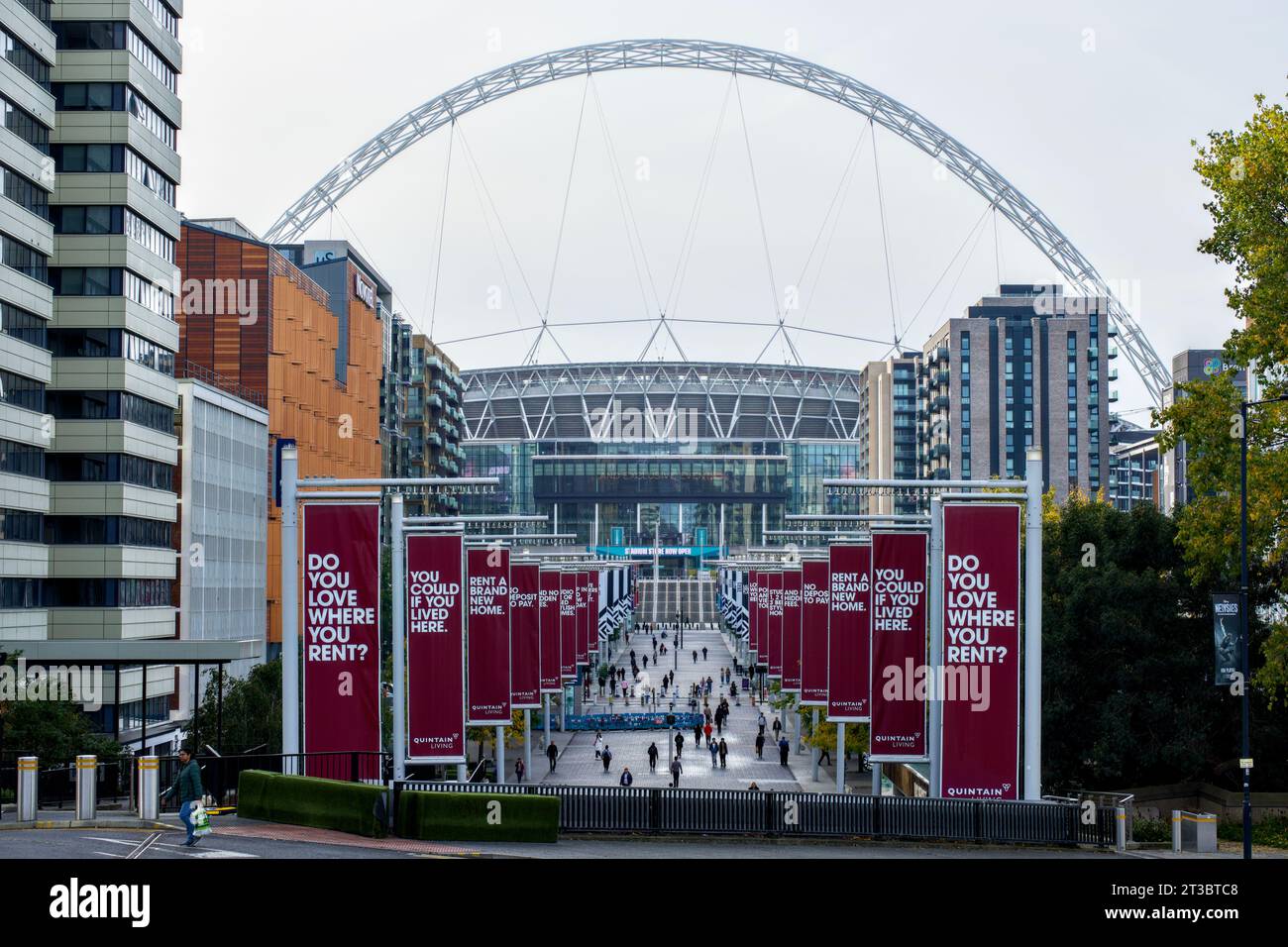 People walking along Olympic Way with the National Football Stadium in ...