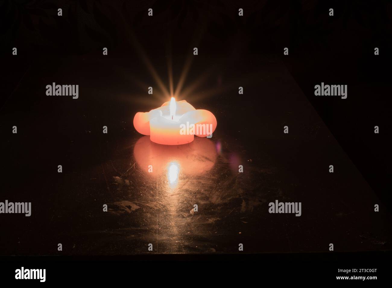 one burning candle with reflection against black background Stock Photo ...
