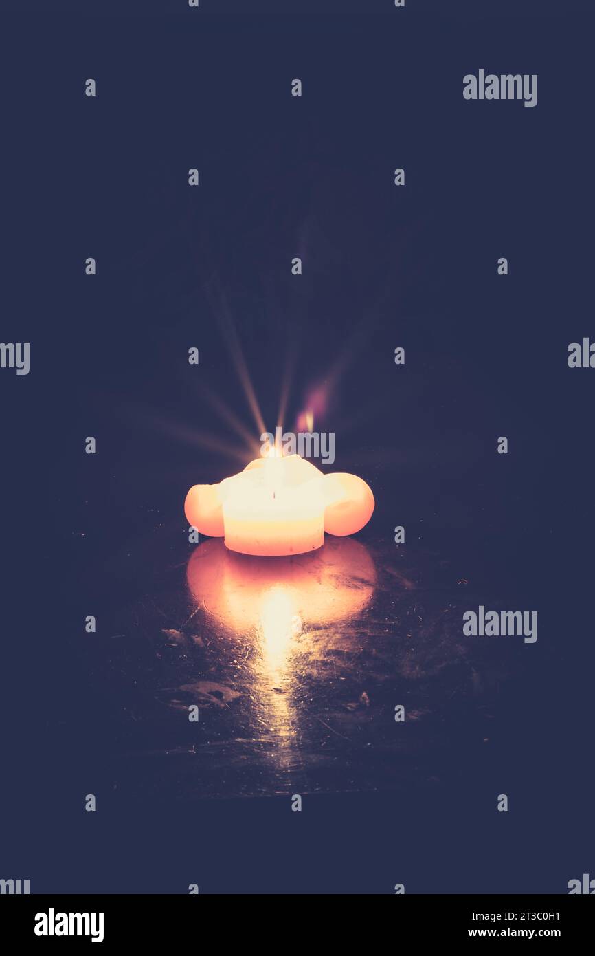 one burning candle with reflection against black background Stock Photo ...