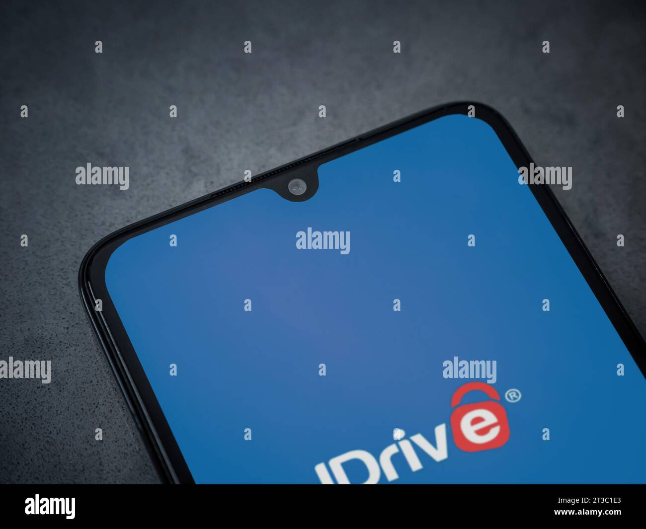 Lod, Israel - July 16,2023: IDrive Online Backup app launch screen on smartphone on dark marble ...