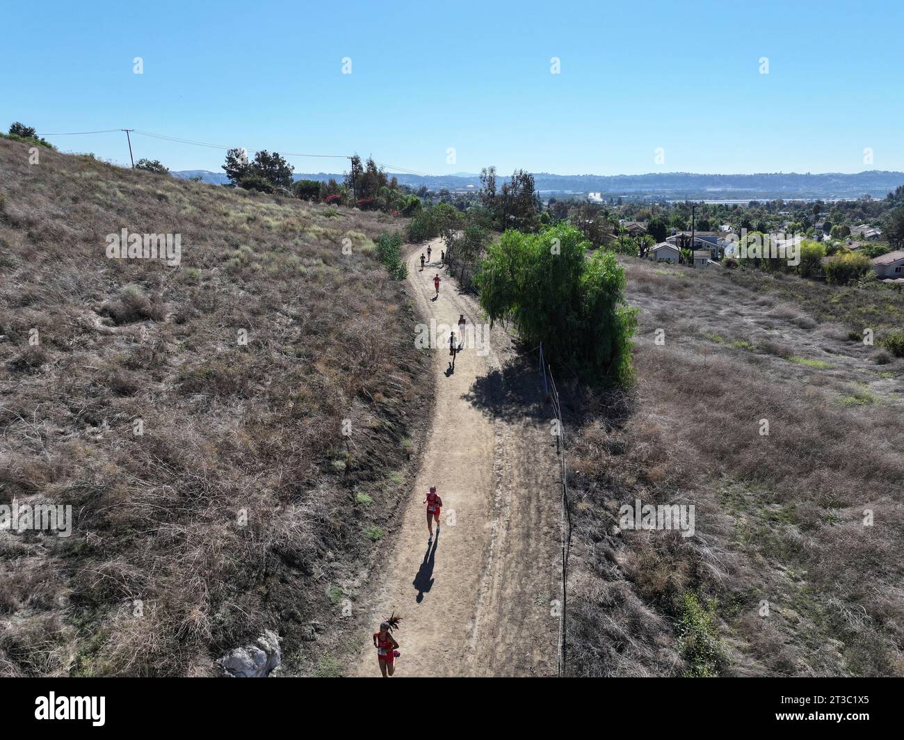 A general overall aerial view as runners descend Poop Out Hill during ...