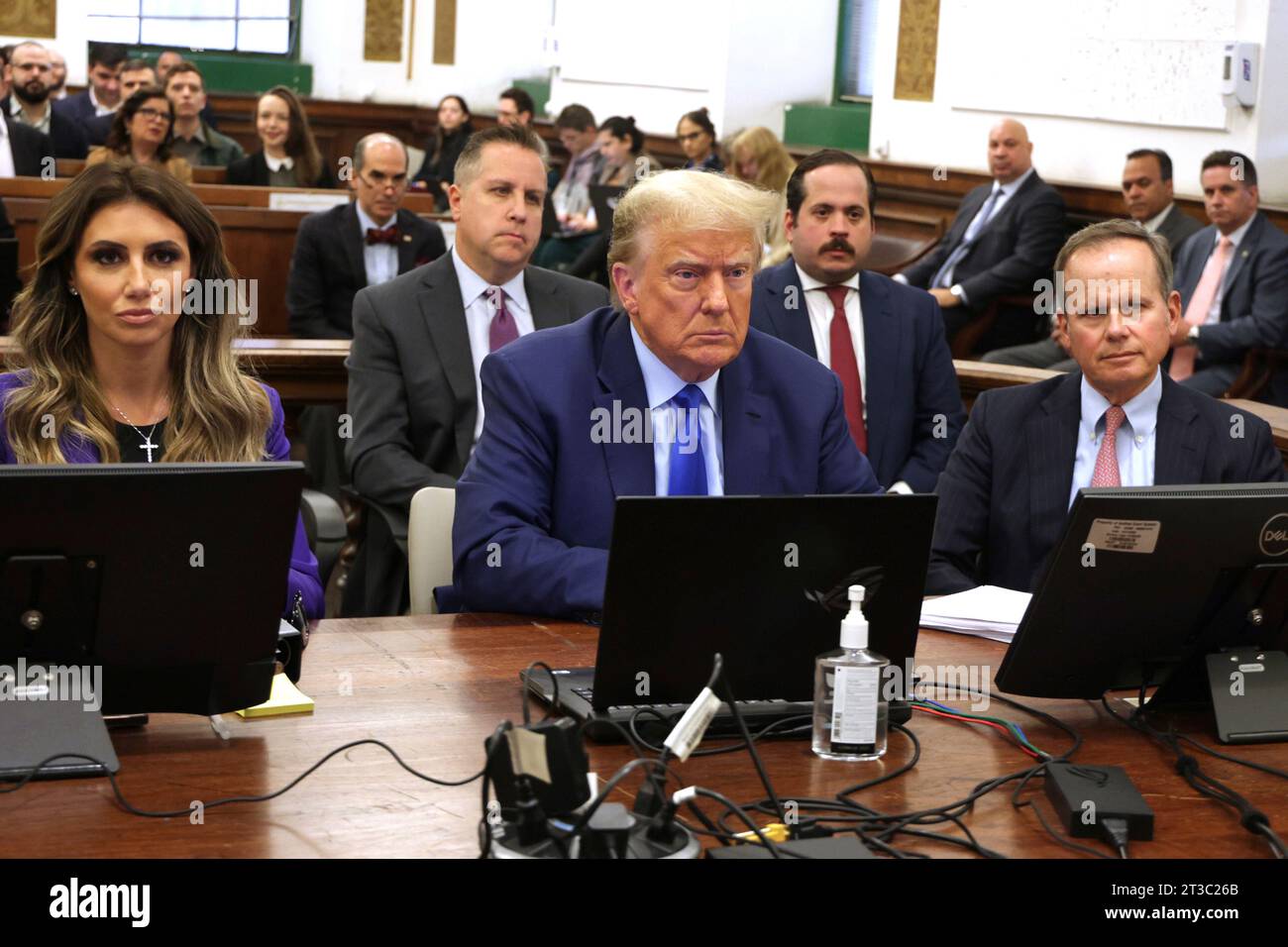 Former President Donald Trump and his lawyers Alina Habba, left, and ...