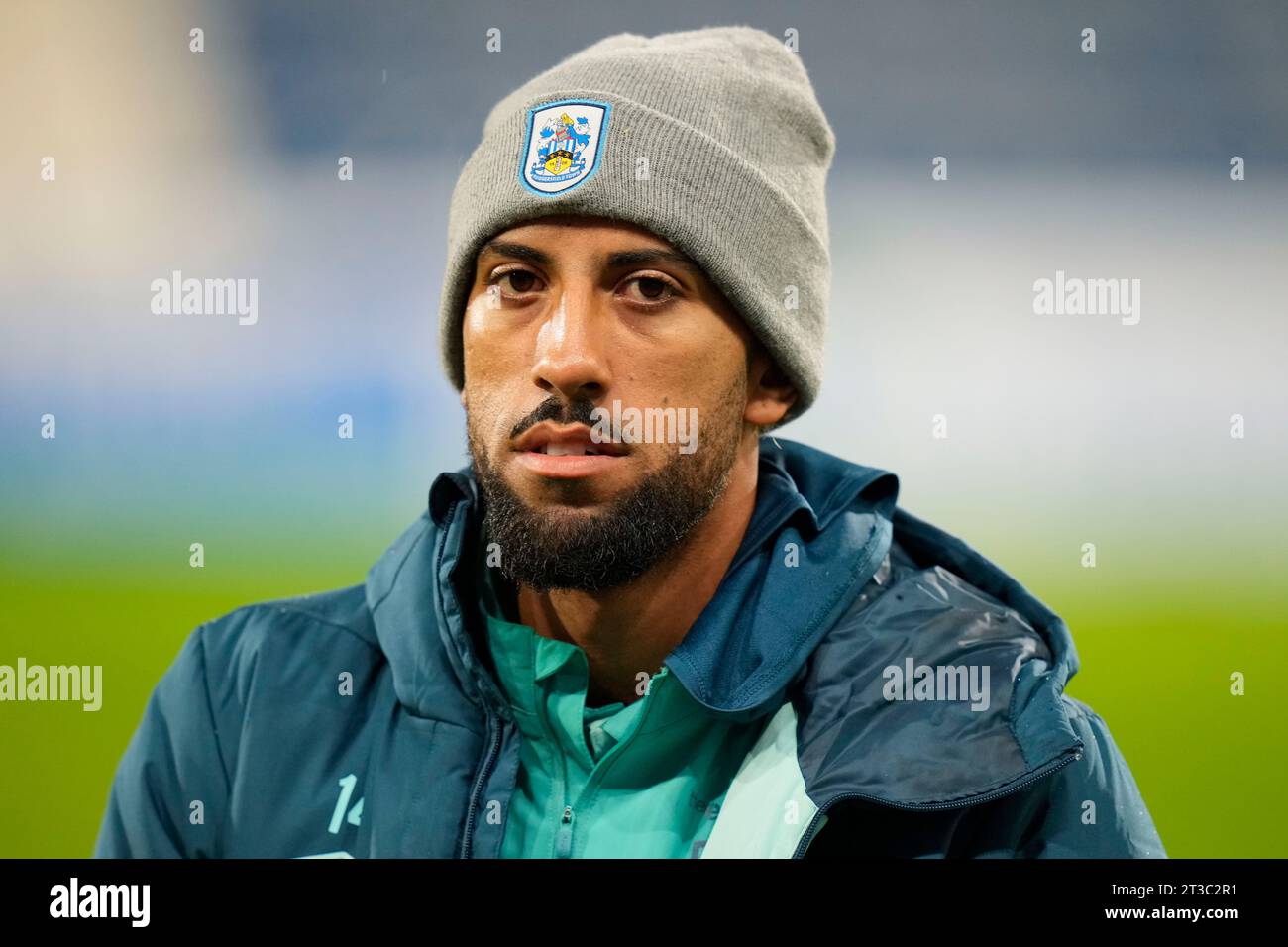 Sorba Thomas #14 of Huddersfield Town inspects the pitch before the Sky ...