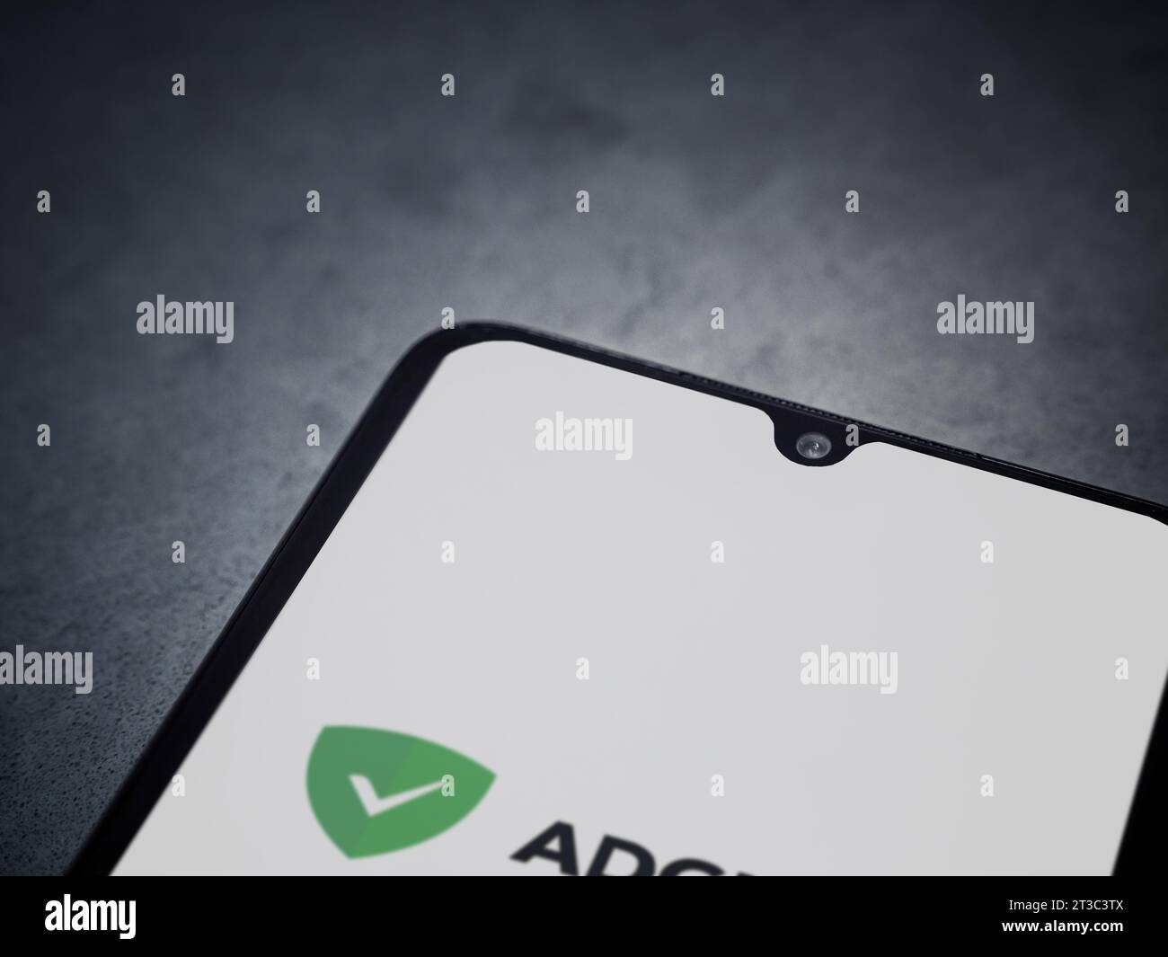 Lod, Israel - July 16,2023: AdGuard app launch screen on smartphone on dark marble stone ...
