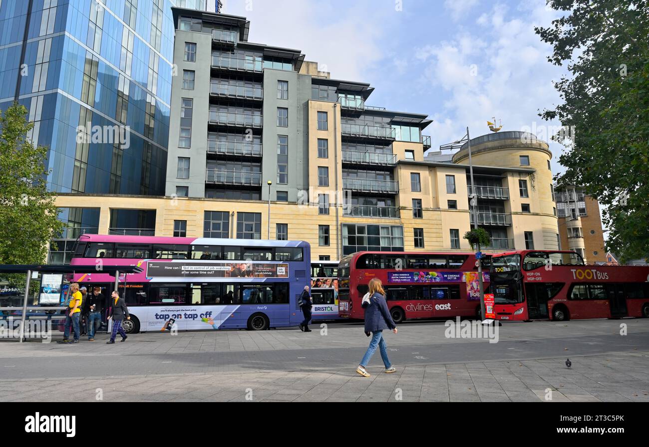 Central Bristol, UK, with multiple buses at bus stops, and tall ...