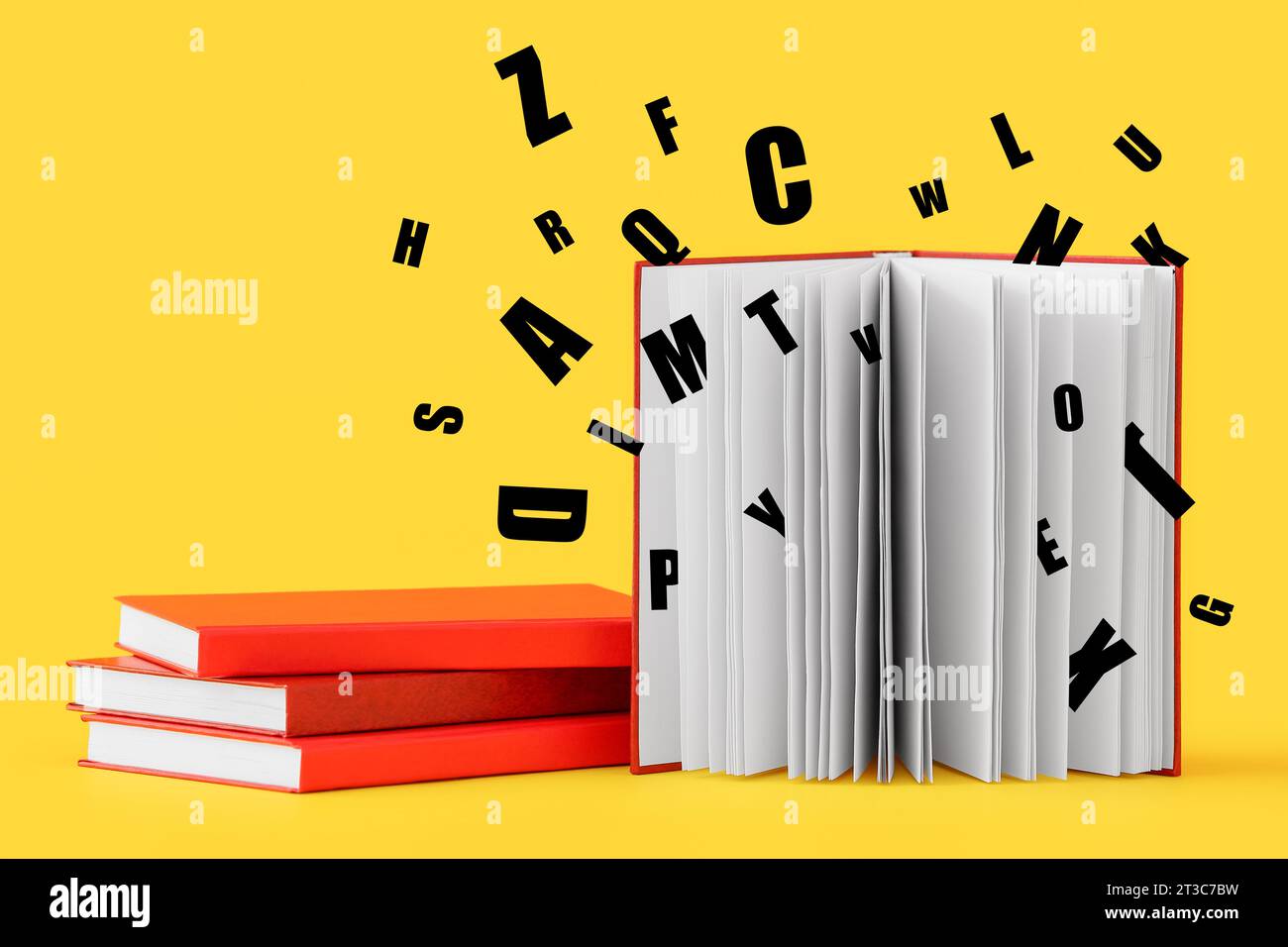 Books and many English letters on yellow background Stock Photo - Alamy