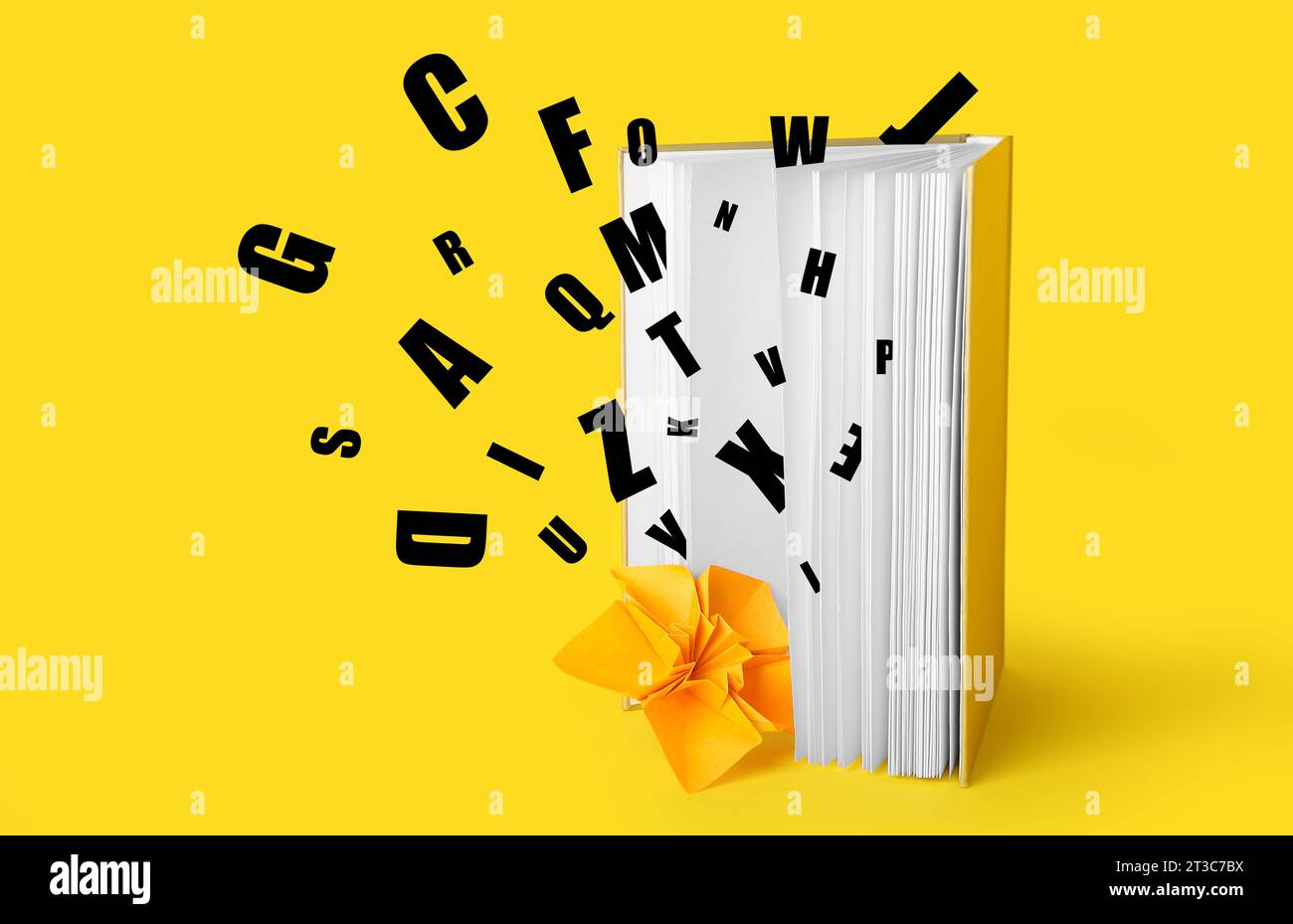 Open book and many English letters on yellow background Stock Photo - Alamy