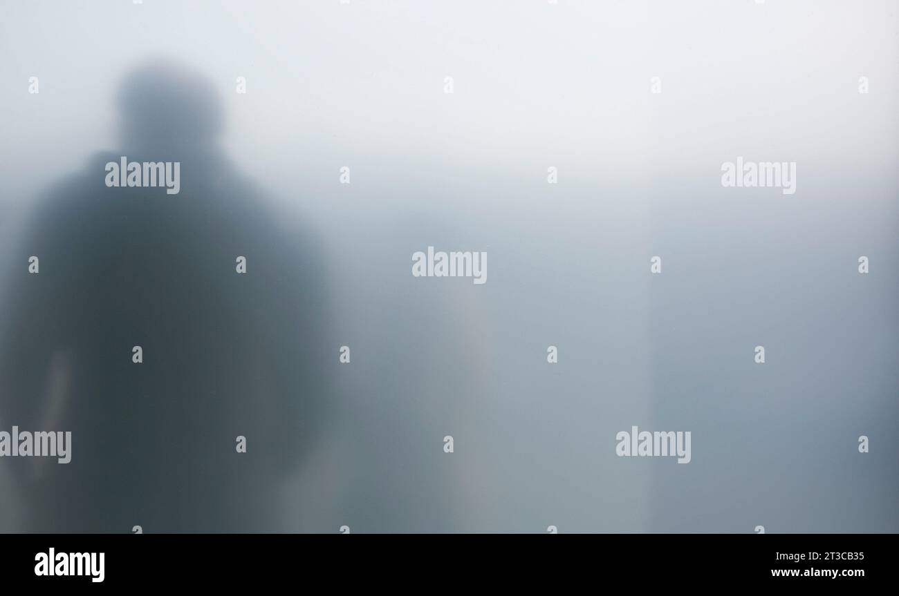 Rear view silhouette of shadowy man viewed through frosted window Stock ...