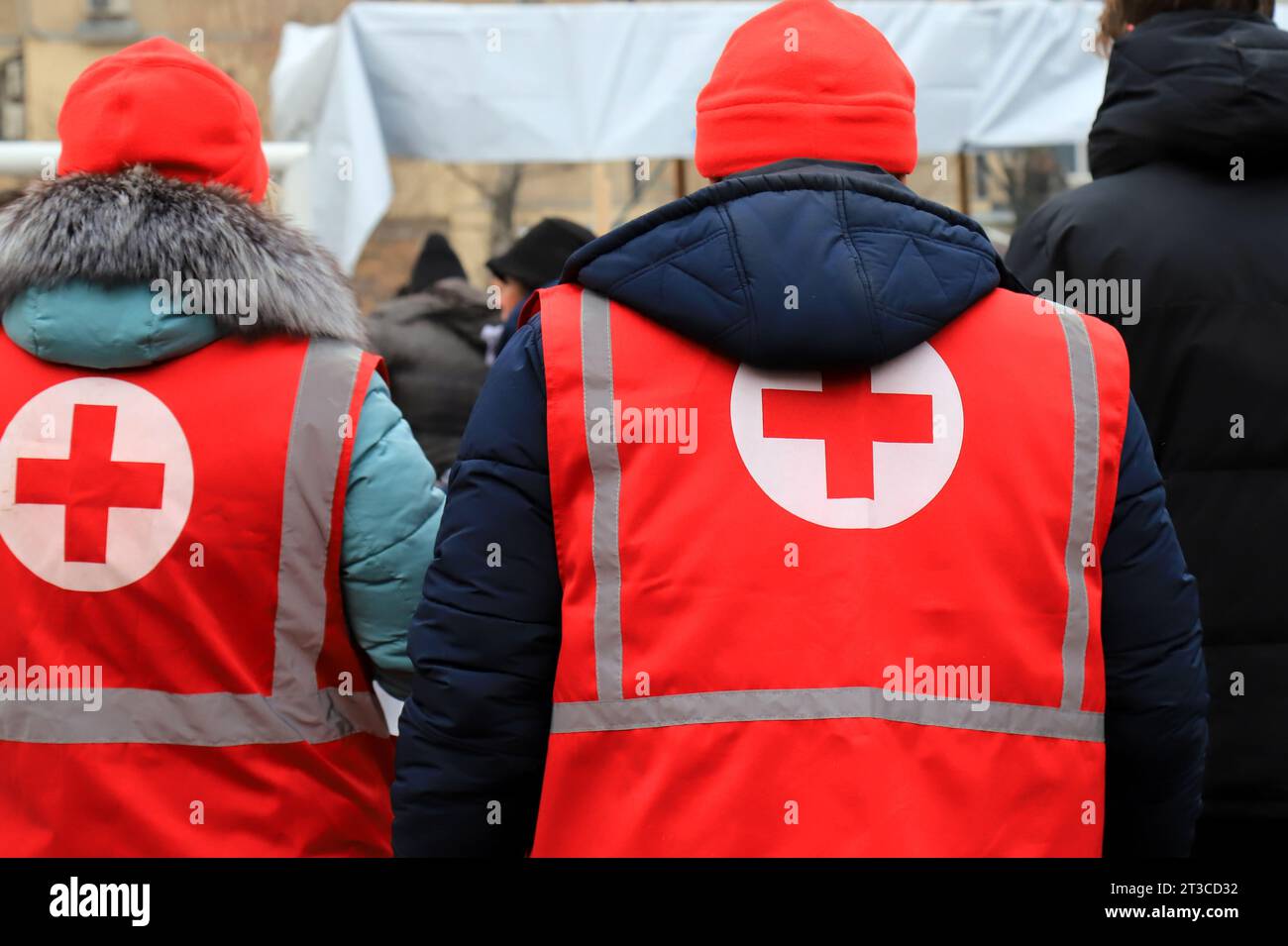 Red Cross volunteers distribute humanitarian aid, help injured people ...