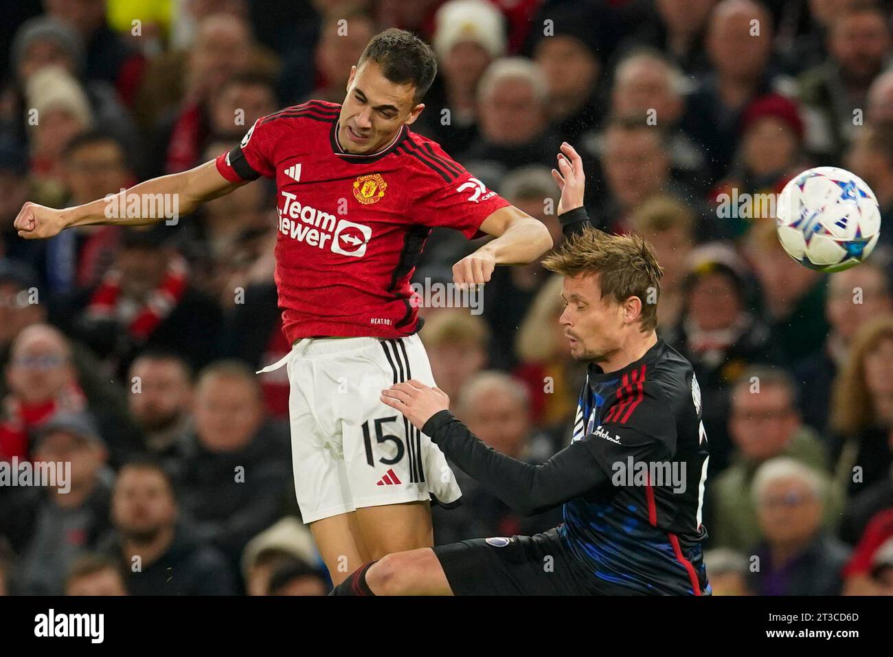Manchester United's Sergio Reguilon, left, duels for the ball with ...