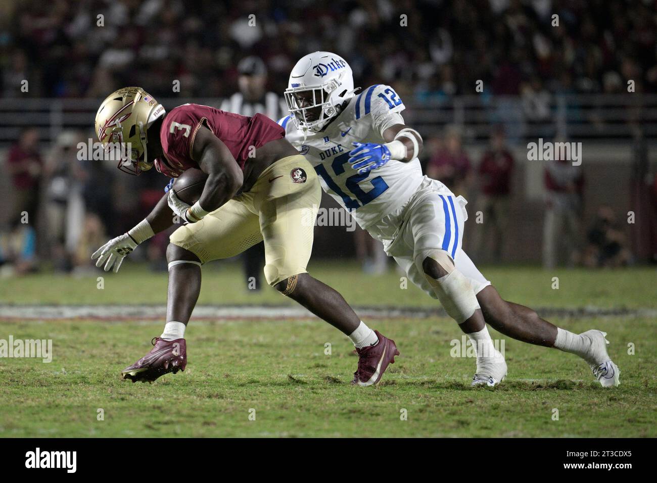 Florida State running back Trey Benson (3) is tackled by Duke ...