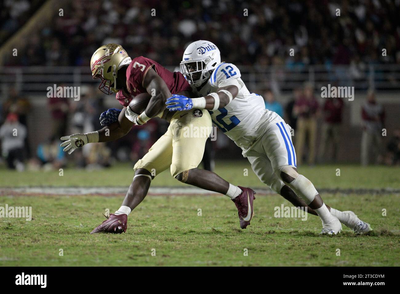Florida State running back Trey Benson (3) is tackled by Duke ...