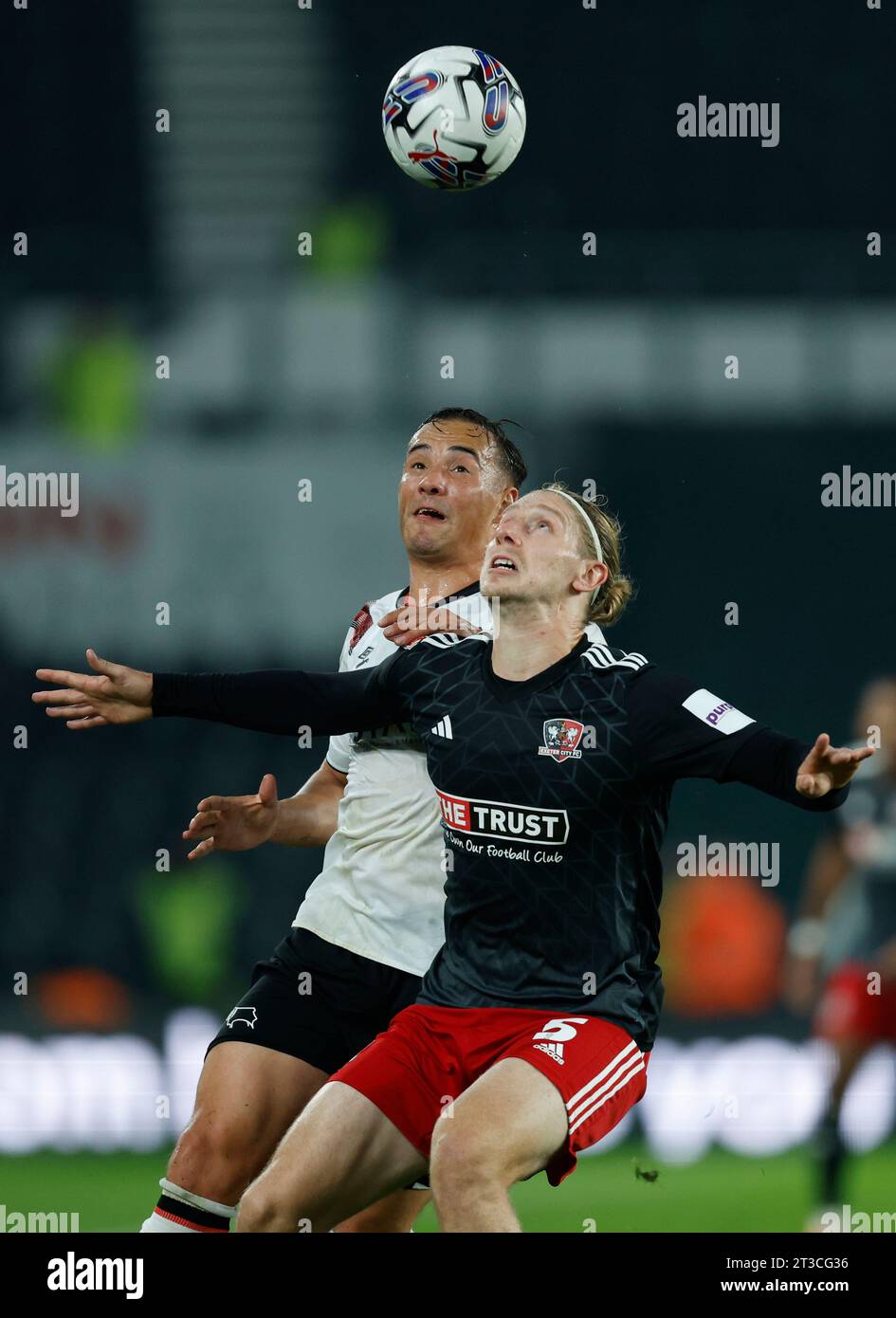 Derby County's Kane Wilson battles for the ball with Exeter City’s Alex ...