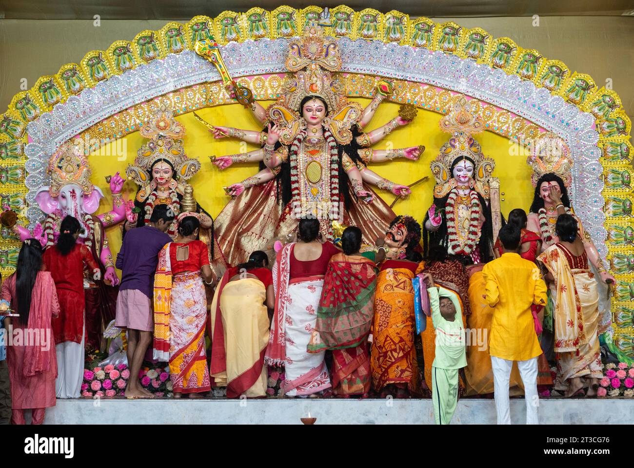 Women offer prayers to Goddess Durga at the end of the Durga Puja ...