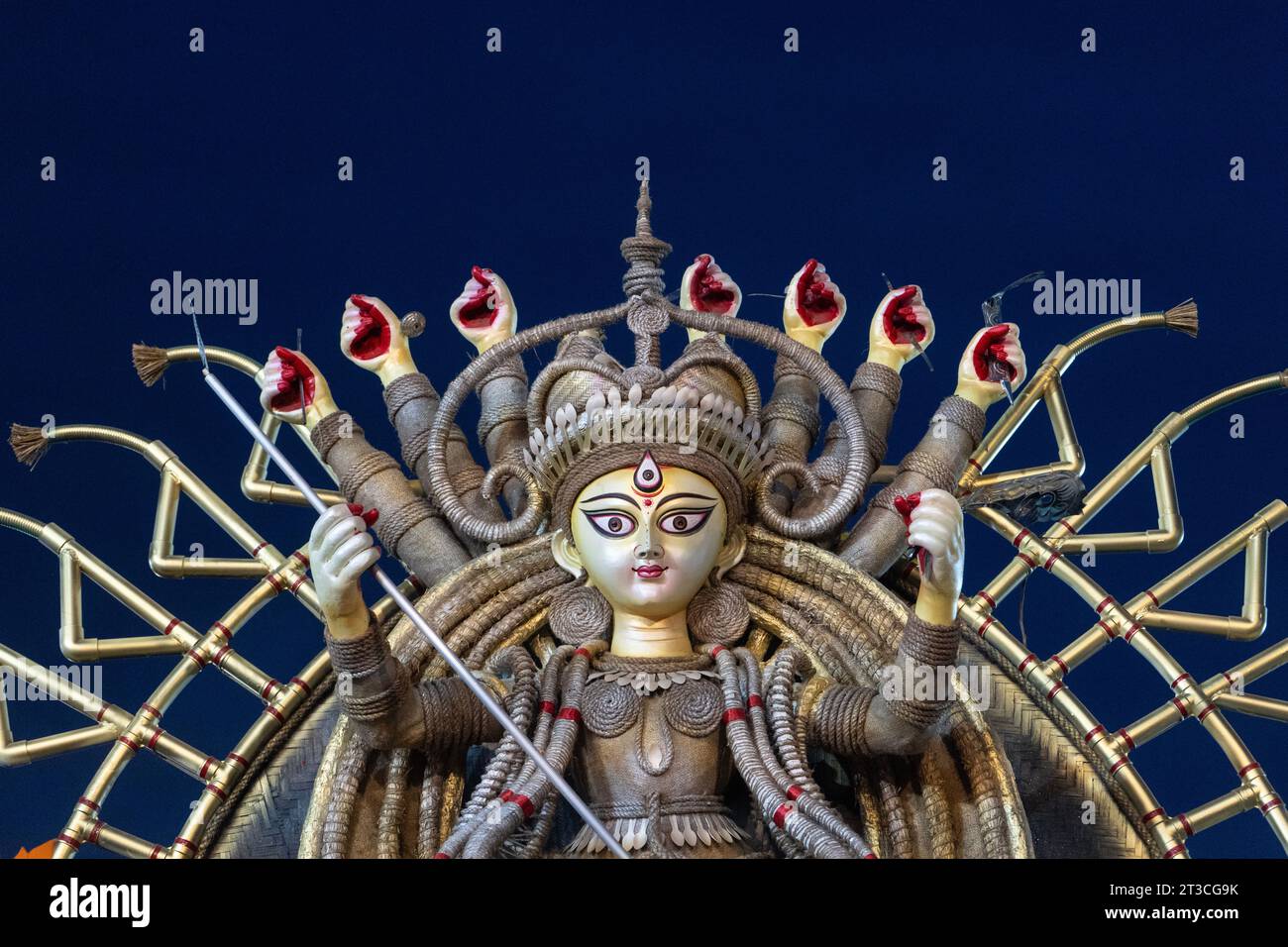 An idol of Goddess Durga arrives to immerse in the Brahmaputra river at ...