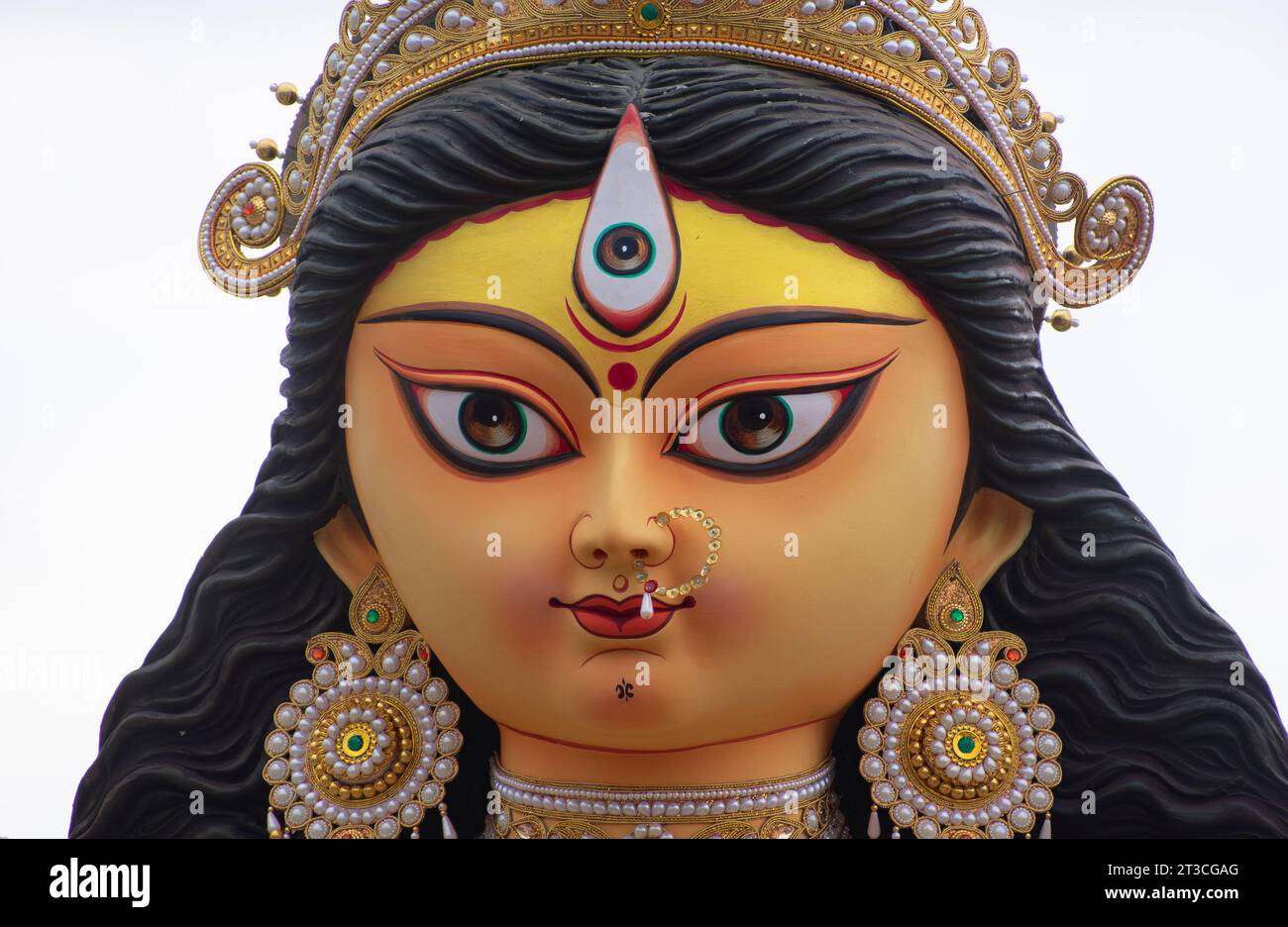 An idol of Goddess Durga arrives to immerse in the Brahmaputra river at ...