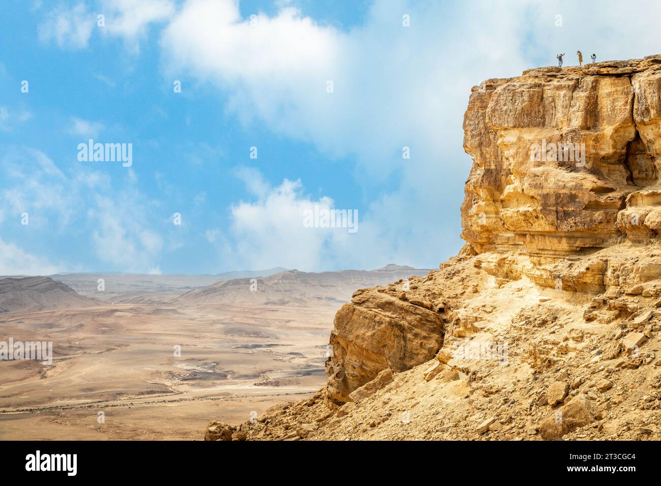 Rock with small people on the top at Makhtesh Ramon, erosion crater ...