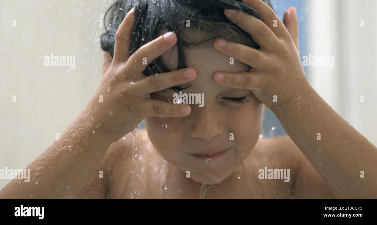 Kid Showering in Super Slow-Motion, Water Droplets Cascading and ...