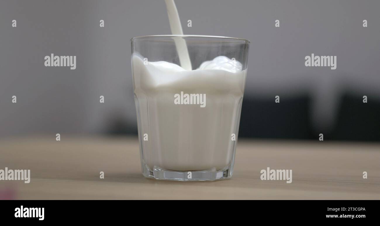 Pouring Milk into Glass in Super Slow-Motion 800fps, Emphasizing ...