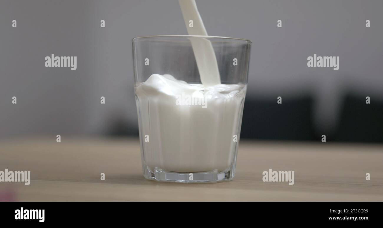 Pouring Milk into Glass in Super Slow-Motion 800fps, Emphasizing ...