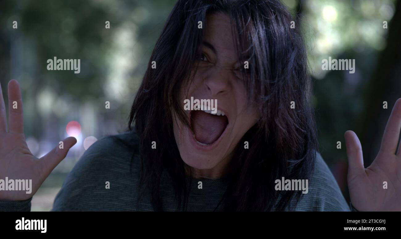 Funny woman reacting with surprise and shock to camera in super slow ...