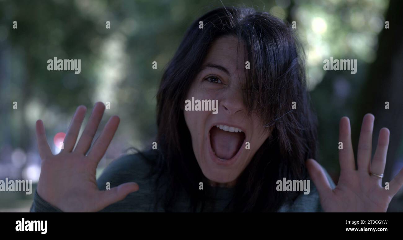 Funny woman reacting with surprise and shock to camera in super slow ...