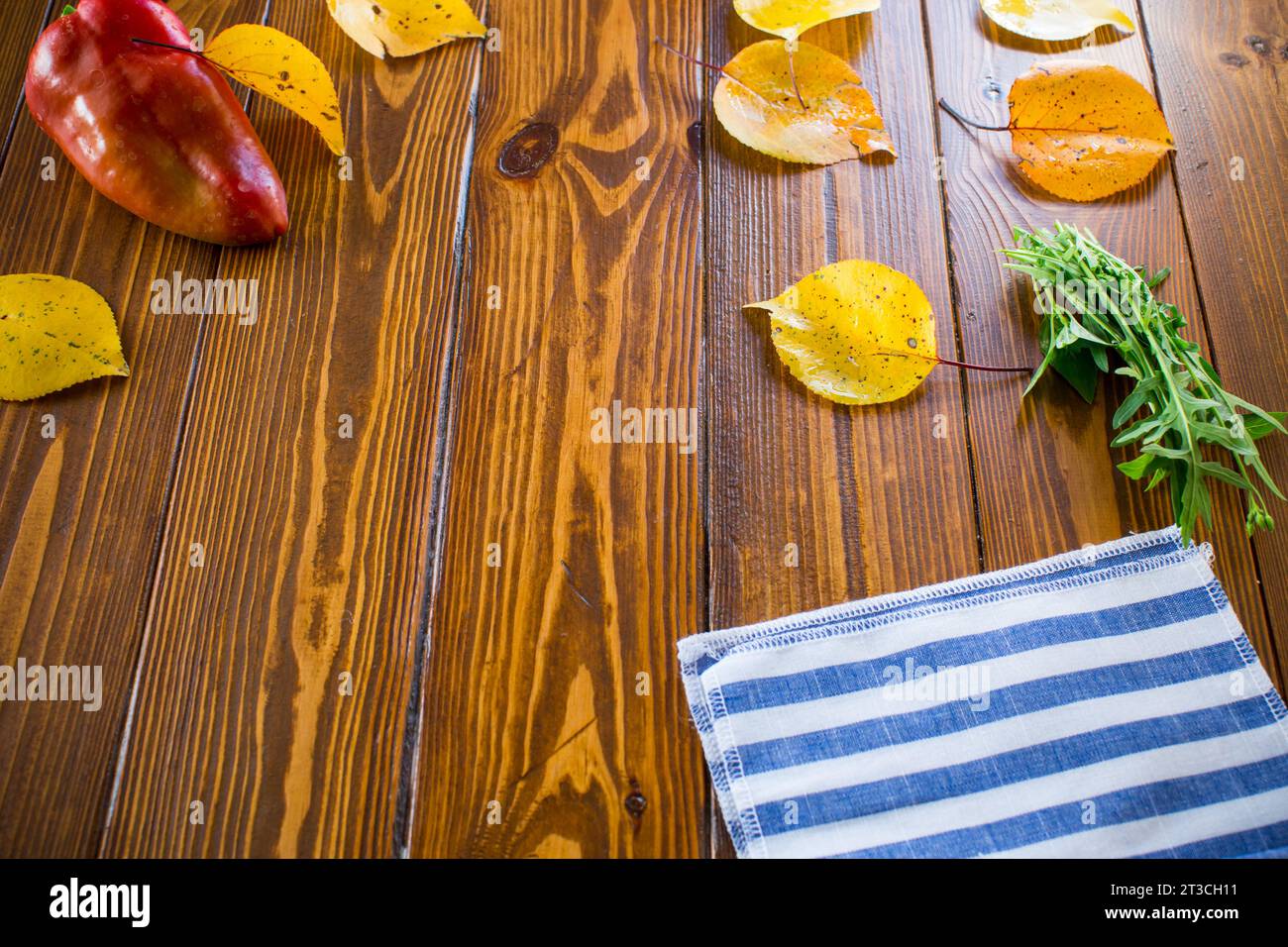 wooden background with empty clean space in the center, autumn foliage ...