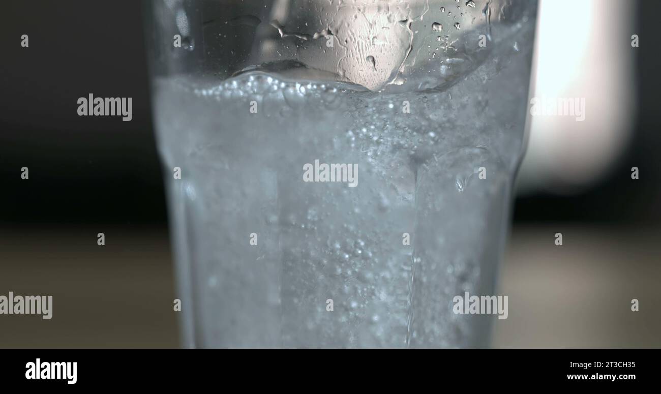 Pouring Sprinkling Water into Glass Cup in Super Slow-Motion 800fps, Hydration and refreshing ...