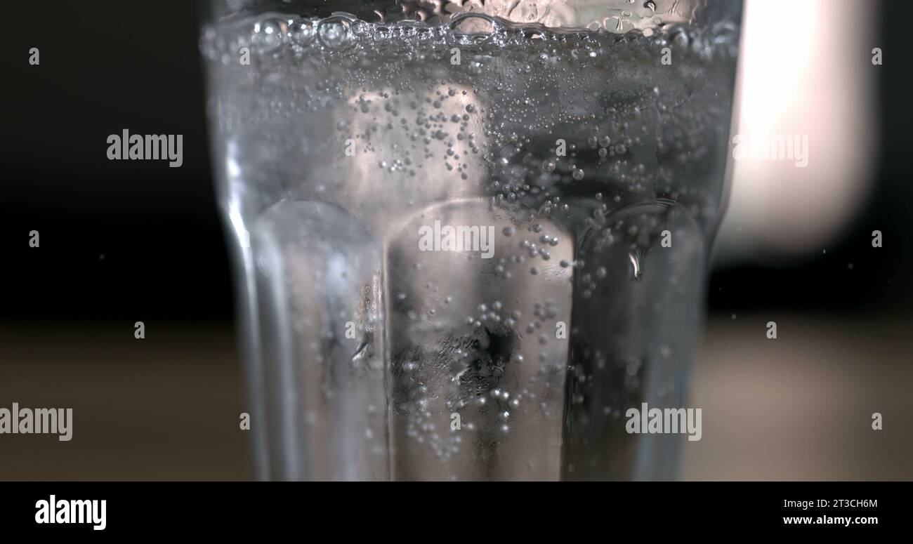 Super Slow-Motion Capture of Water Droplets Bubbling onto Surface Stock Photo - Alamy