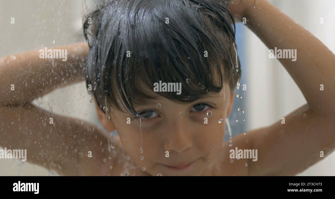 Super slow-motion clip of kid showering during bath time with droplets ...