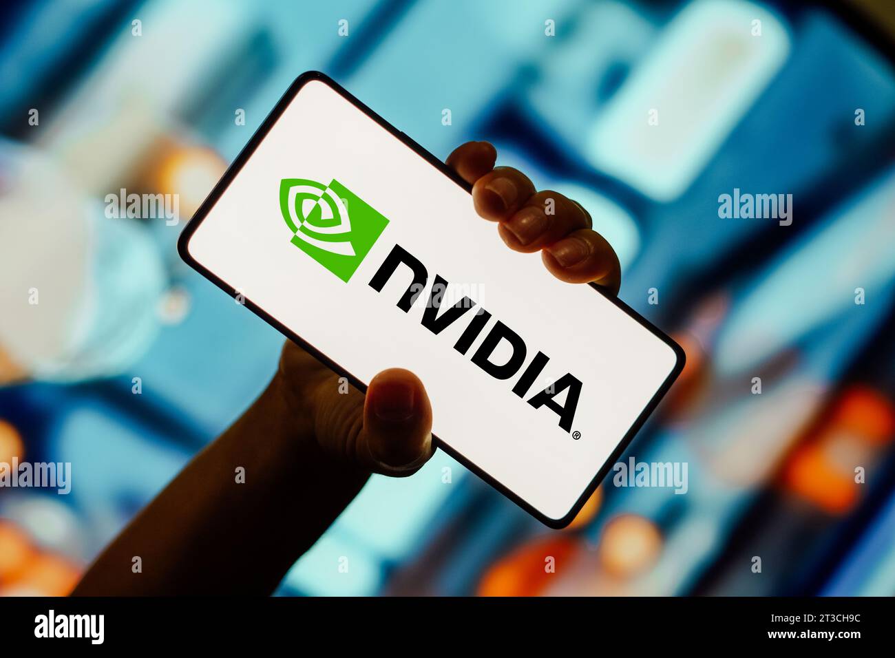 In this photo illustration, the Nvidia logo is displayed on a ...